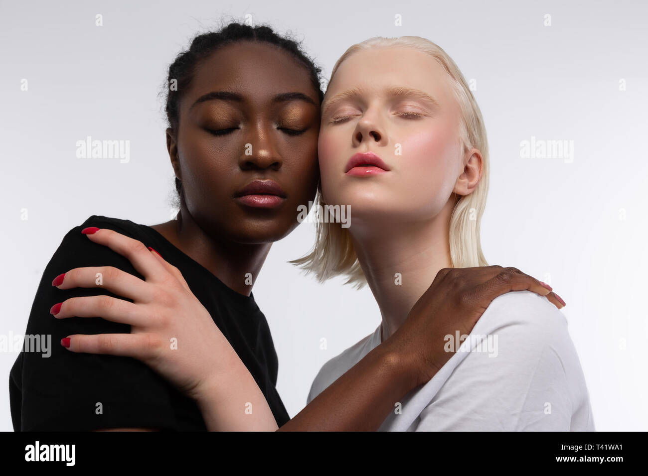 Diversity and anti-racism. Two good-looking young models posing for ...