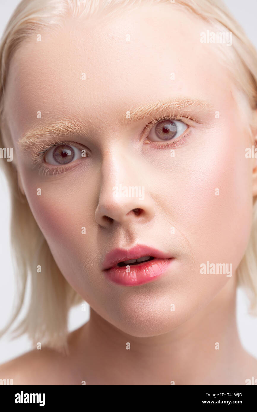 Face expression. Grey-eyed young woman with white skin having very ...