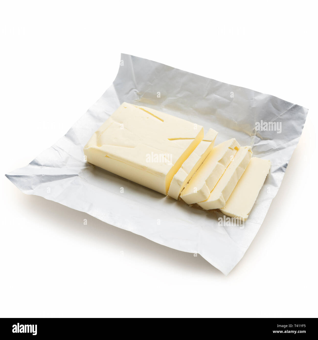 Piece of butter on white Stock Photo - Alamy