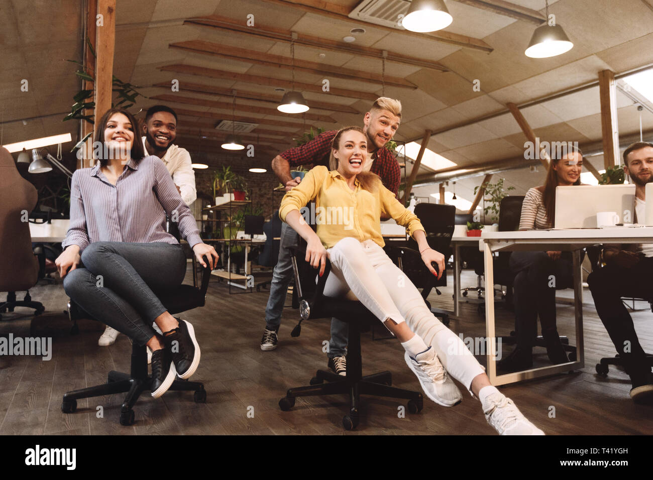 Work hard play hard. Business people having fun in office Stock Photo ...