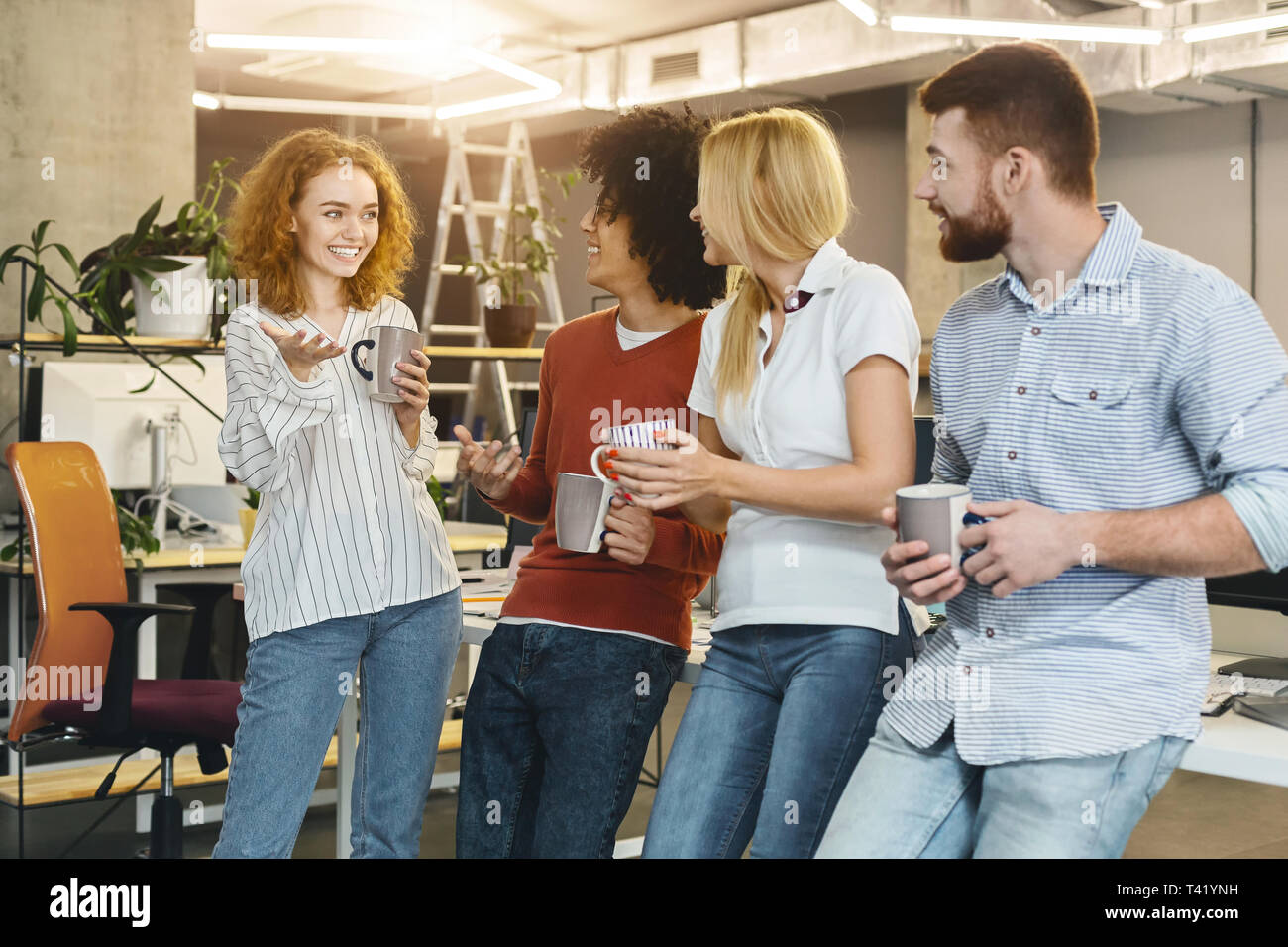 Young colleagues enjoying coffee break in modern office Stock Photo - Alamy