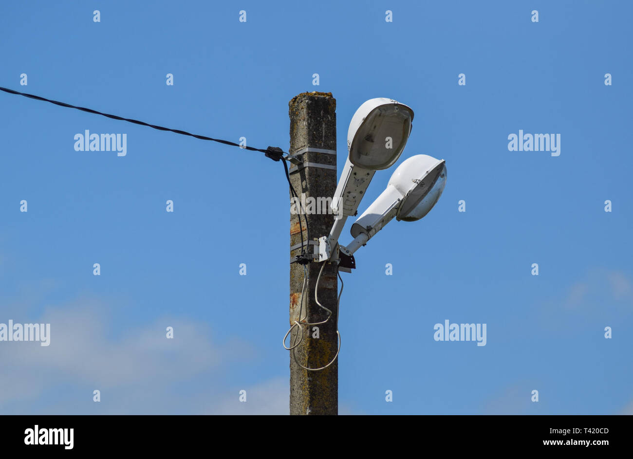 Lanterns on the pole. A pillar of power line with lighting fixtures ...