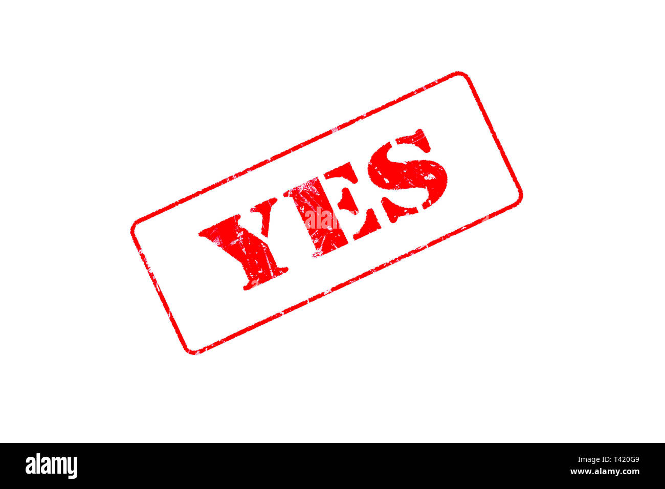 Rubber stamp concept showing a red stamp reading Yes Stock Photo - Alamy