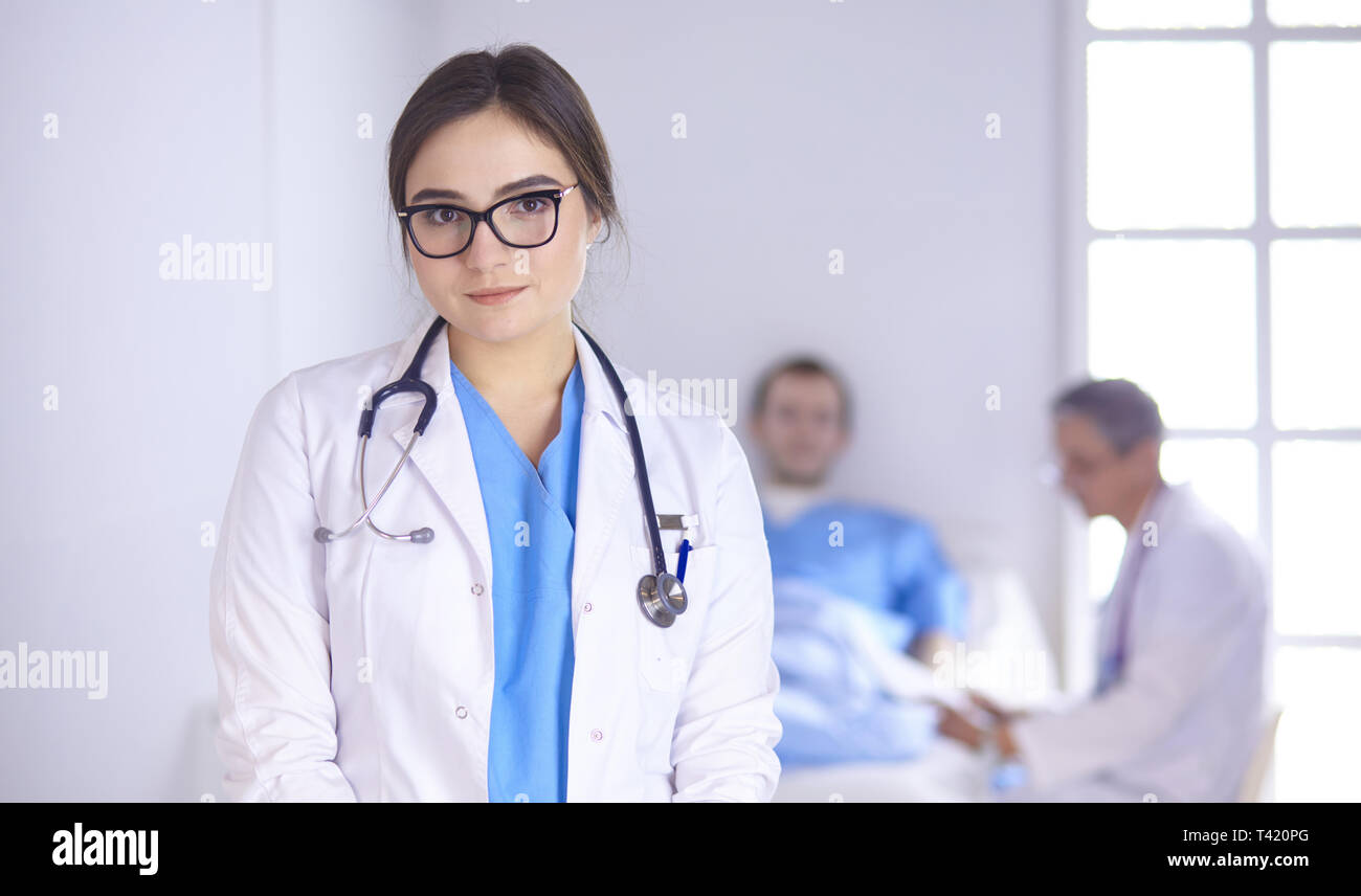 Doctor checking heart beat of patient in bed with stethoscope Stock ...
