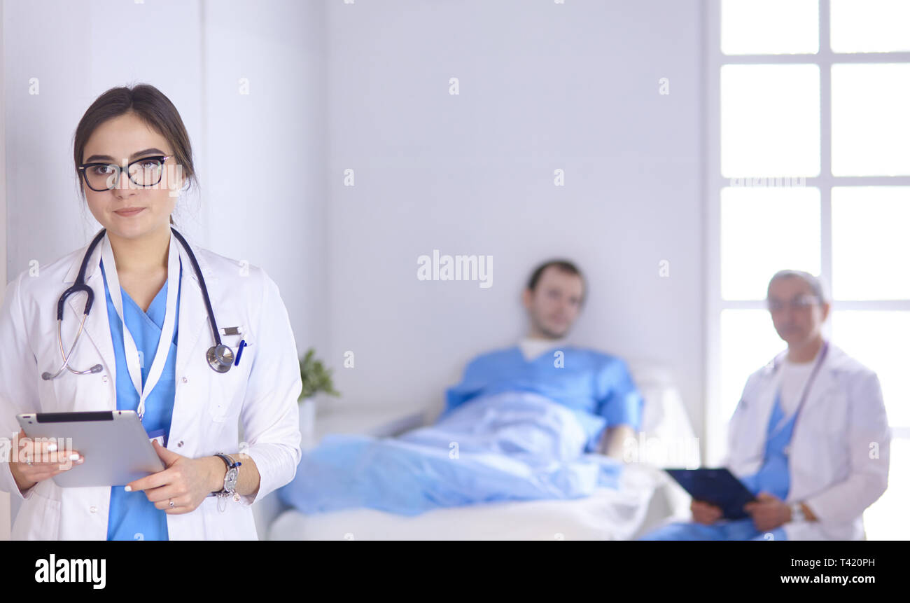 Doctor checking heart beat of patient in bed with stethoscope Stock ...