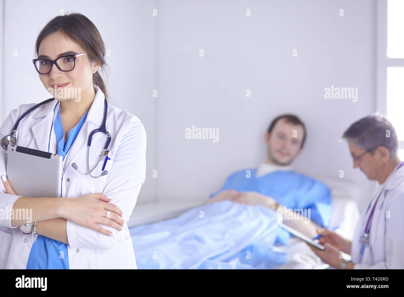 Doctor checking heart beat of patient in bed with stethoscope Stock ...