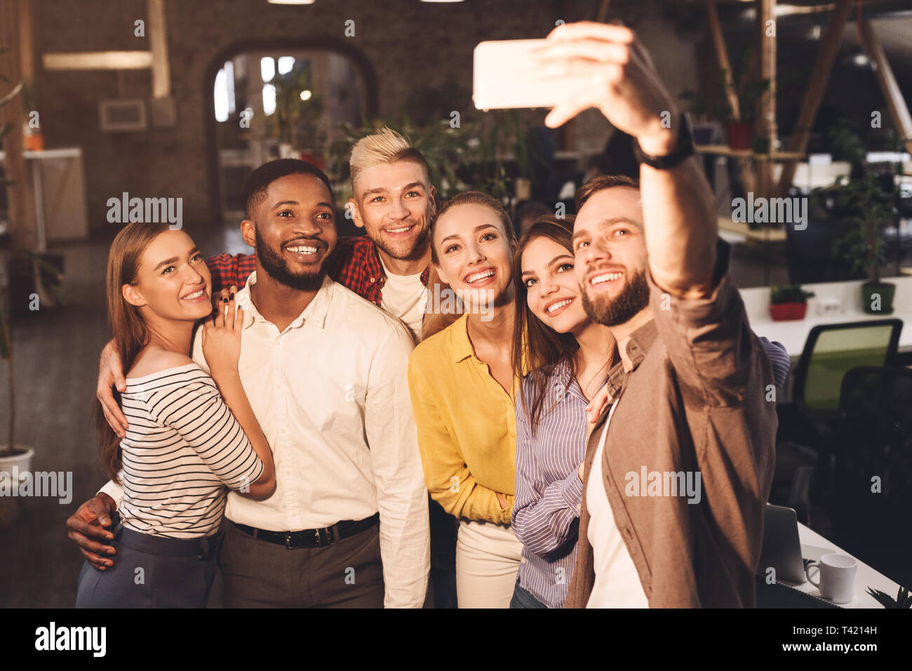 Happy international creative business team taking selfie Stock Photo ...