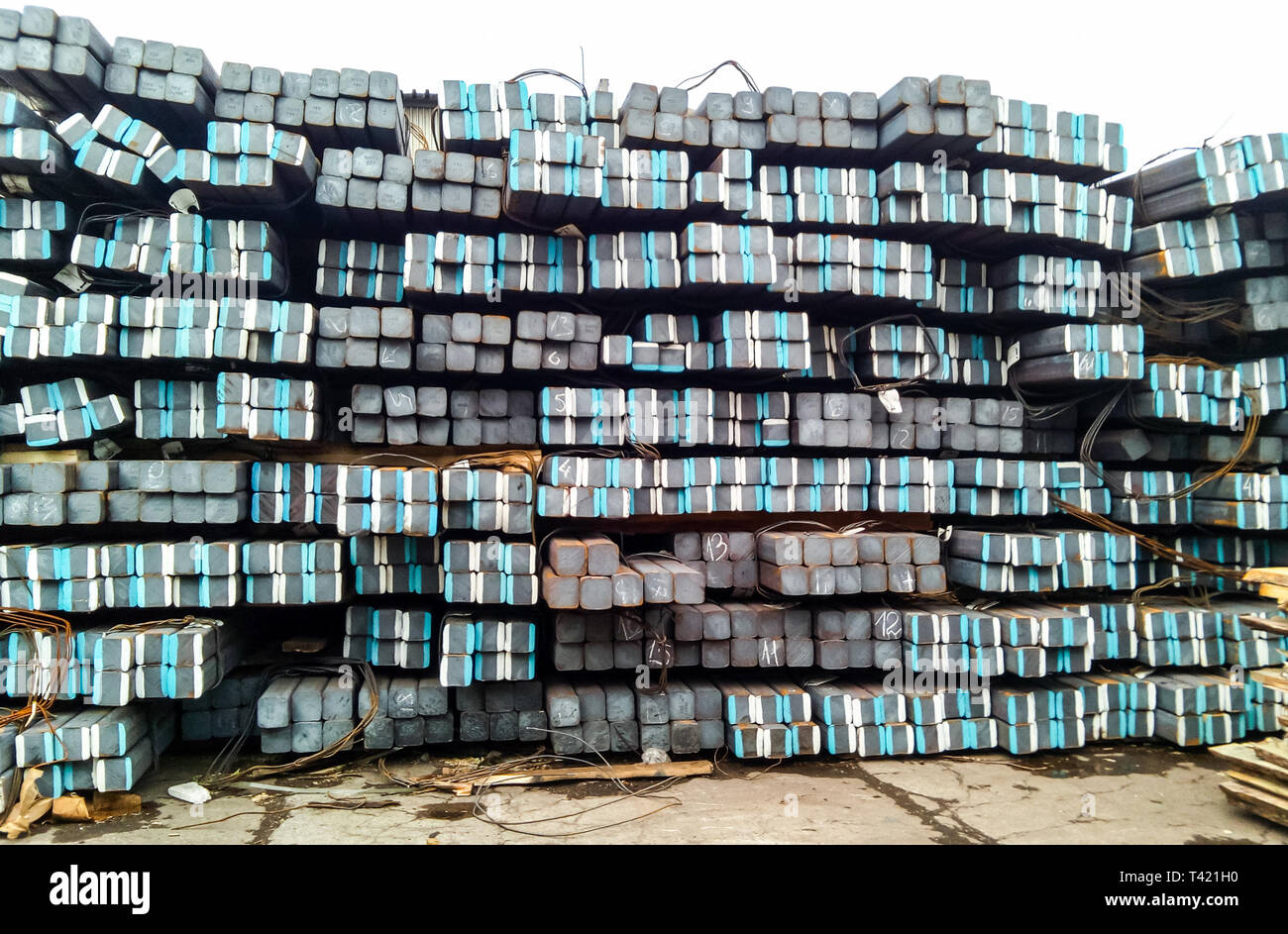 Metal square rods. Warehouse of metal ingots Stock Photo - Alamy
