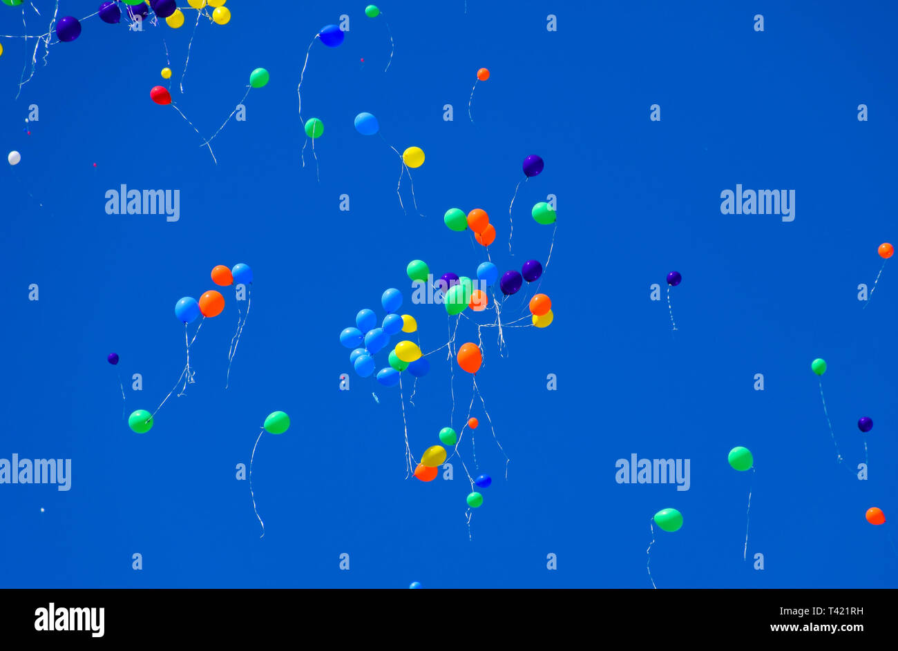 Three helium balloons in sky hi-res stock photography and images - Alamy