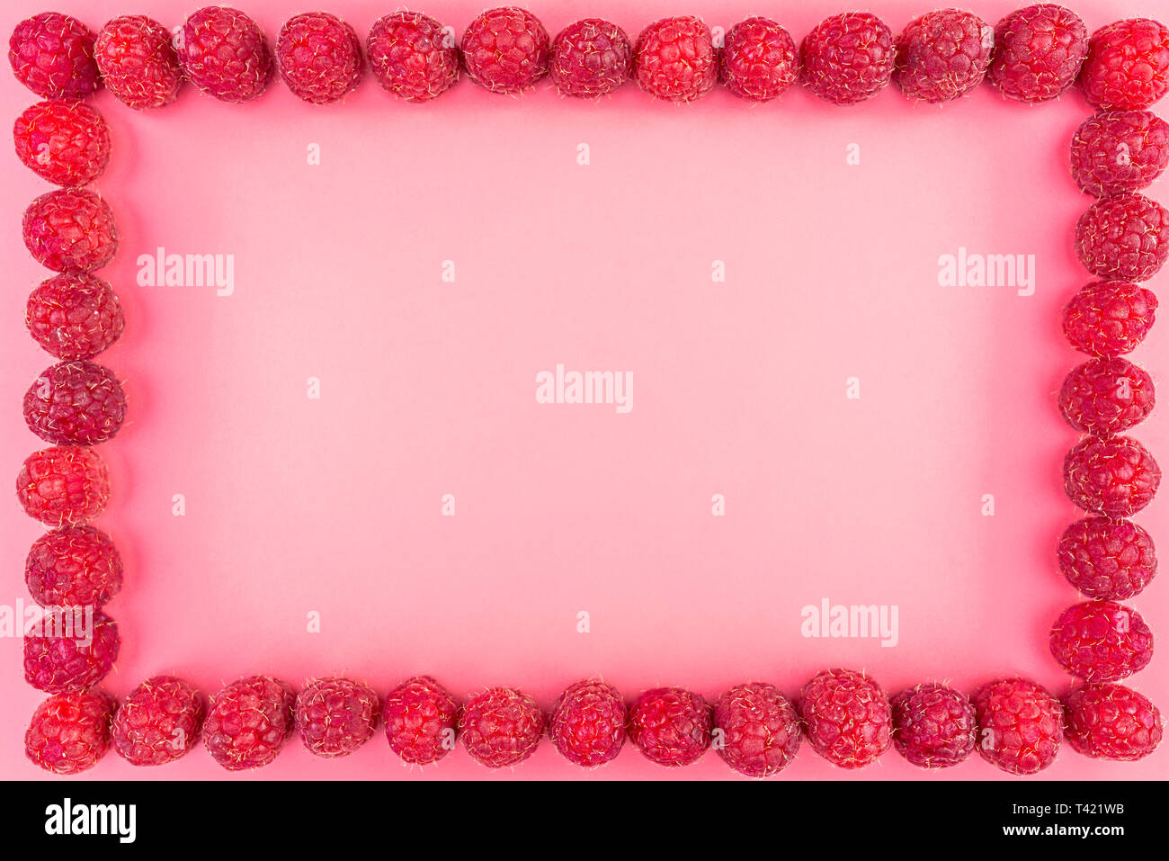 Frame made from fresh raspberries, top view, flat lay, isolated on a ...