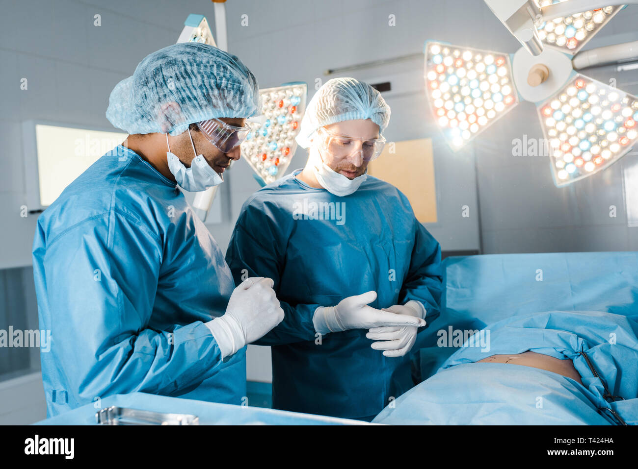 Doctor nurse in protective uniforms hi-res stock photography and images ...