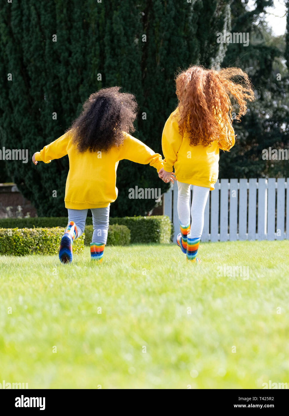 Children skipping enjoying playing outside Stock Photo - Alamy