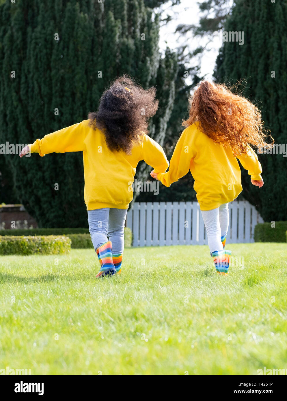 Children skipping enjoying playing outside Stock Photo - Alamy