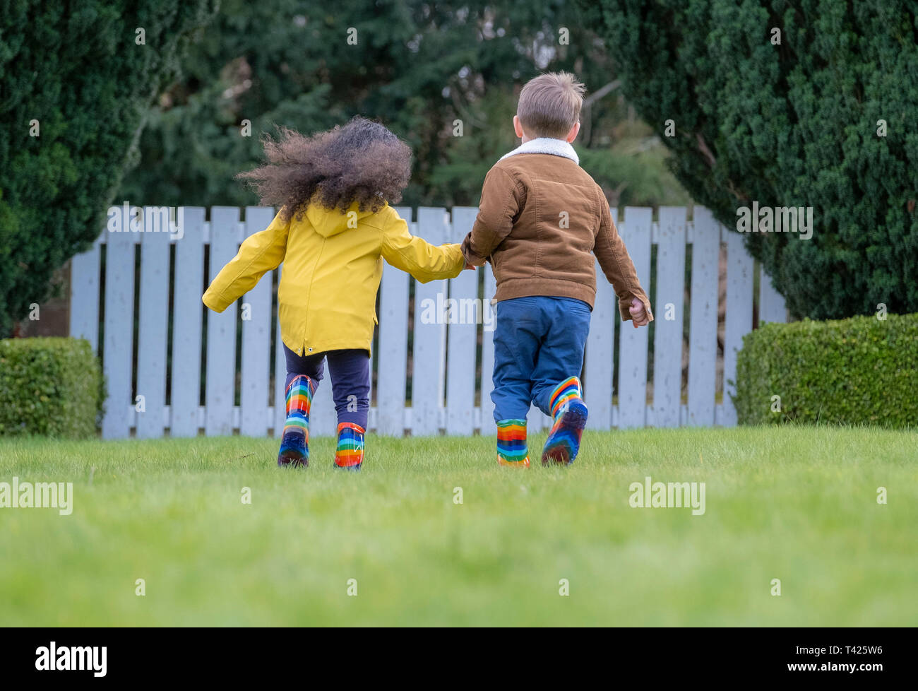 Children skipping enjoying playing outside hi-res stock photography and ...