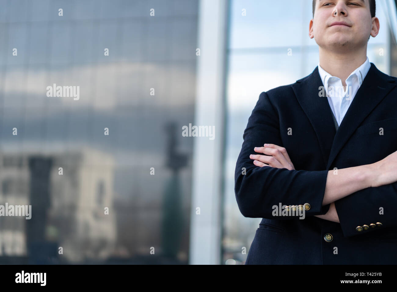 Photo of business man in classic black suit, shirt holding hands folded ...