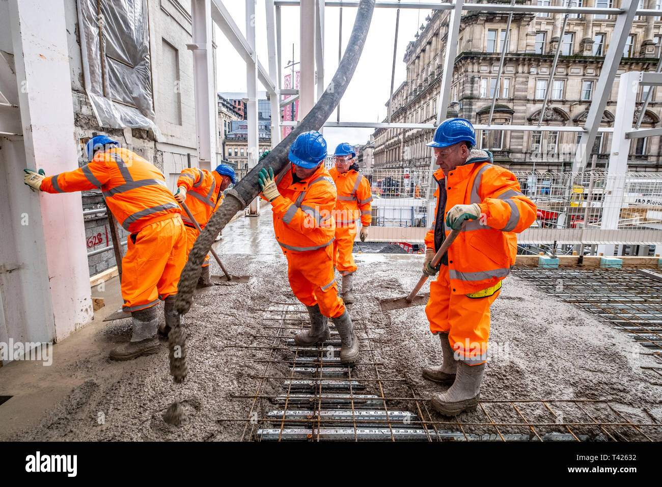 Concrete being poured for new train station platform Stock Photo - Alamy