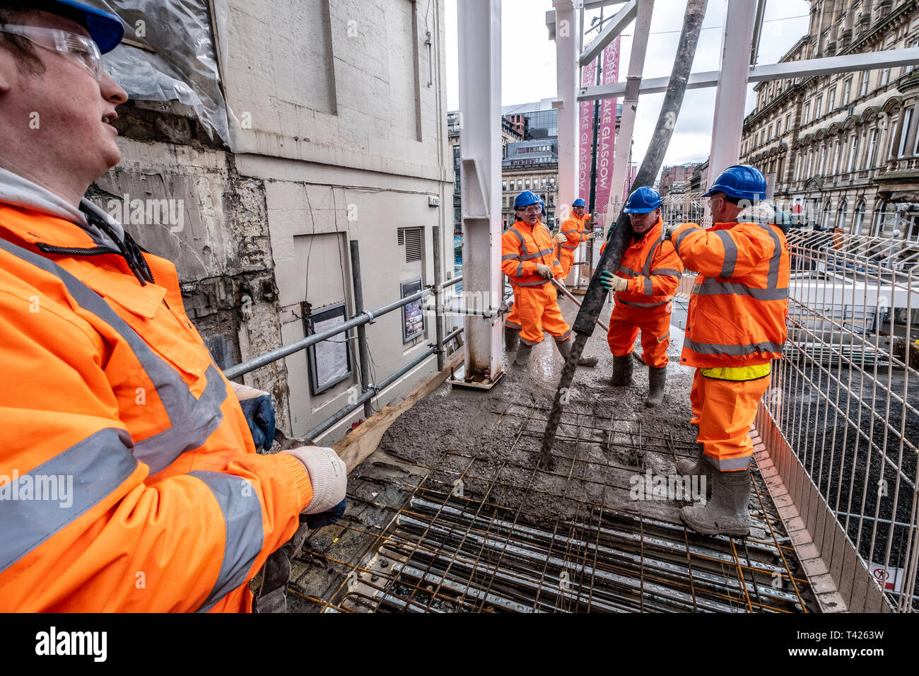 Concrete being poured for new train station platform Stock Photo - Alamy