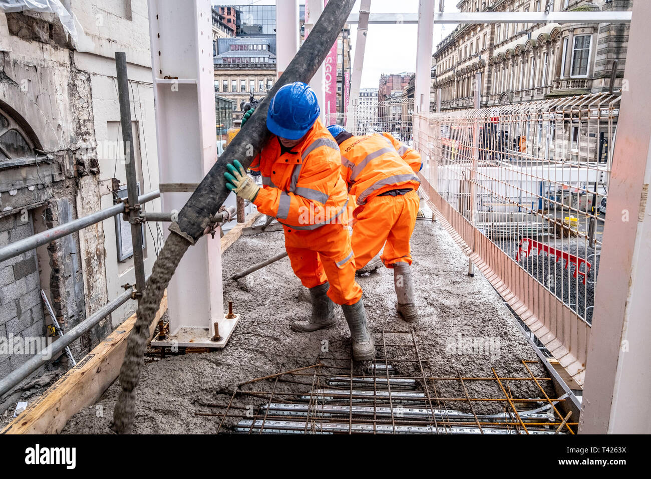 Concrete being poured for new train station platform Stock Photo - Alamy