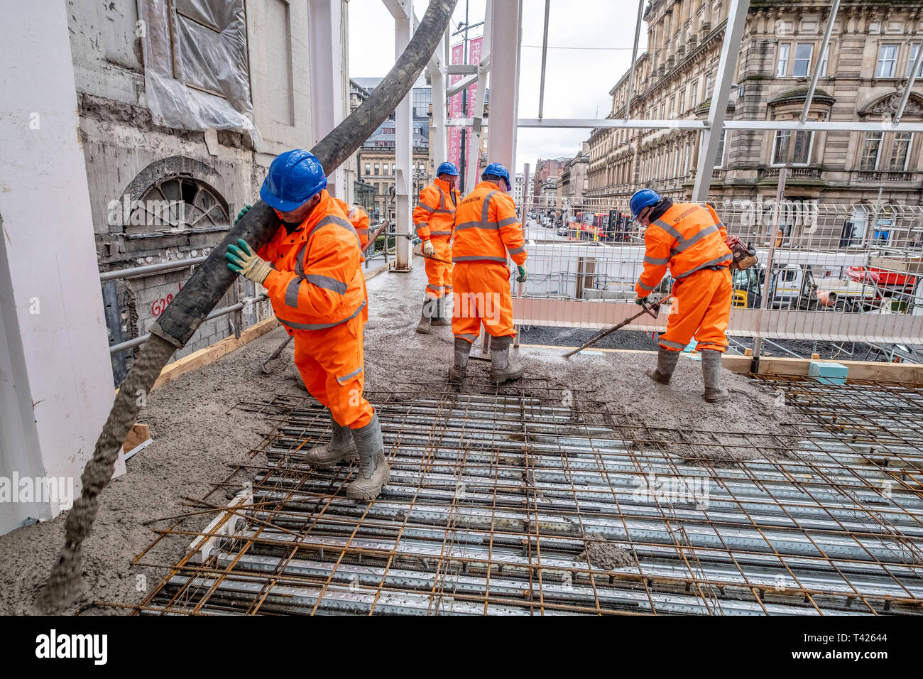 Concrete being poured for new train station platform Stock Photo - Alamy