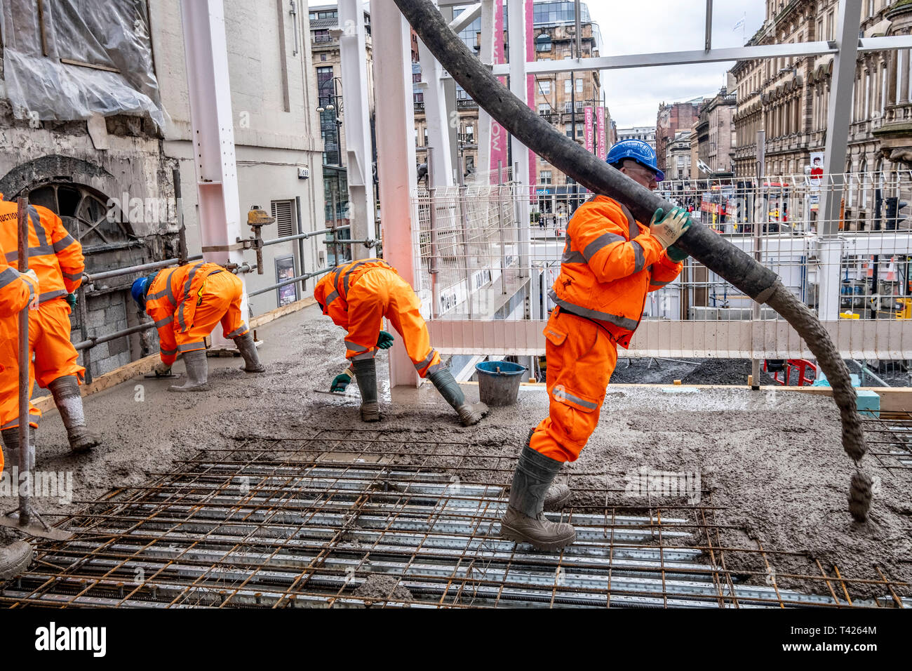 Concrete being poured for new train station platform Stock Photo - Alamy