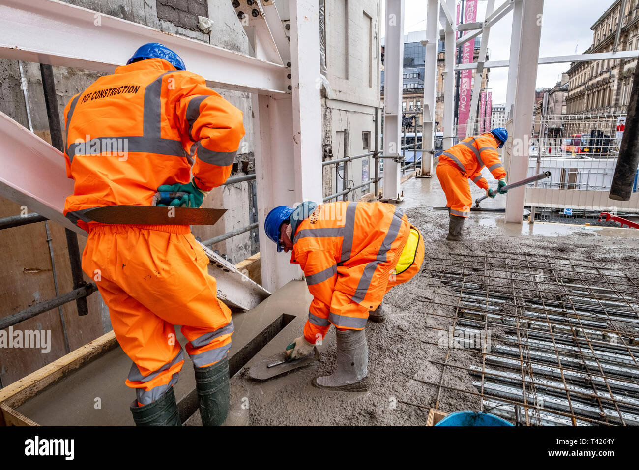 Concrete being poured for new train station platform Stock Photo - Alamy
