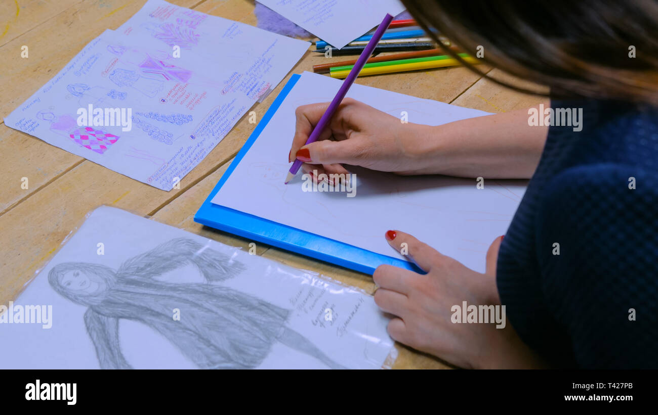 Fashion designer drawing design sketch Stock Photo - Alamy