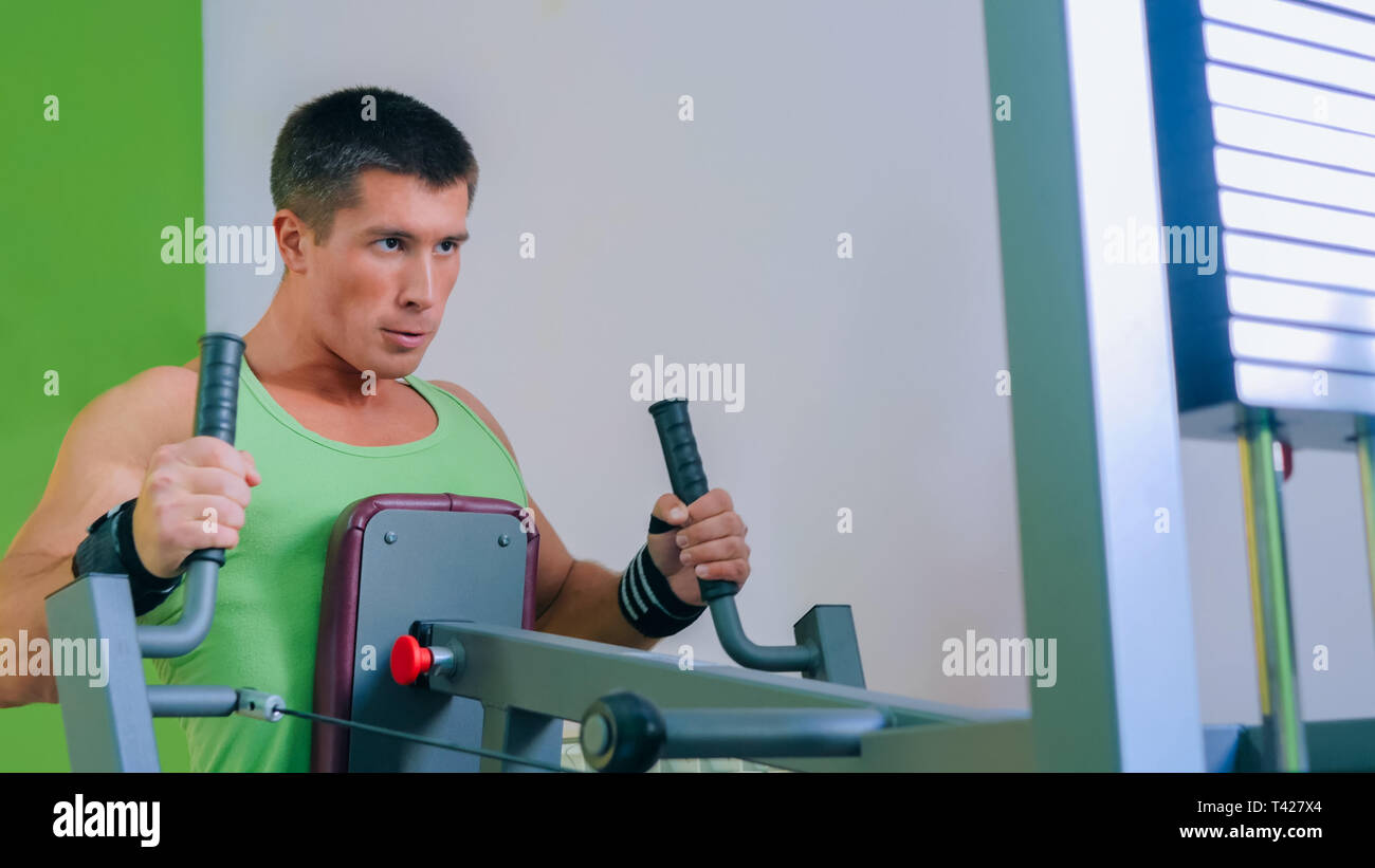 Man using weight machine hi-res stock photography and images - Alamy