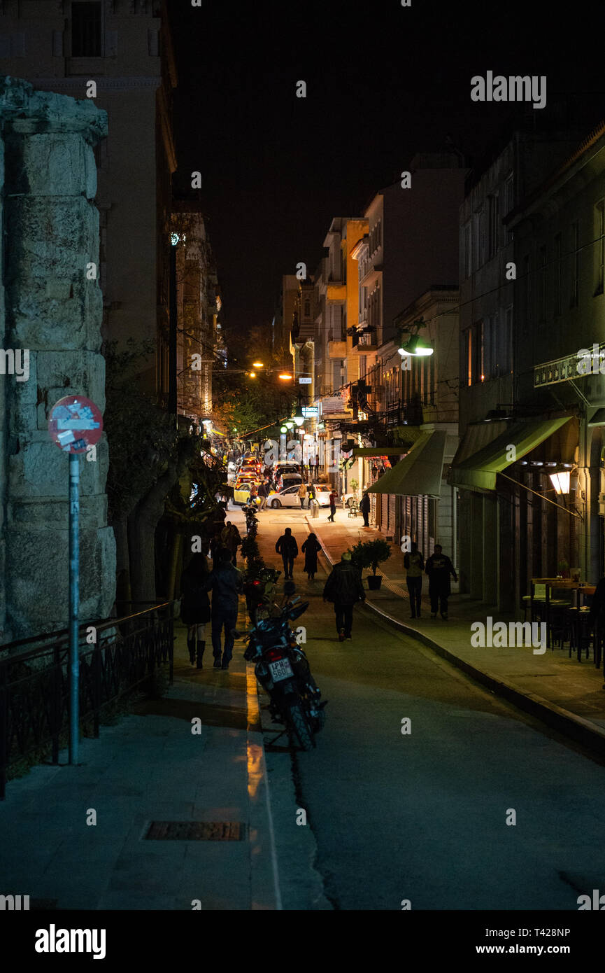 Athens, Greece - 26 Mar 2016: Pedestrians walking on the dark street in ...