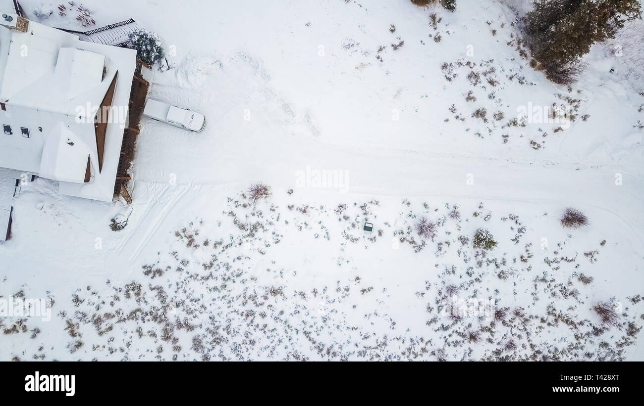 Aerial view of the mountain house covered in snow in the Winter Stock ...