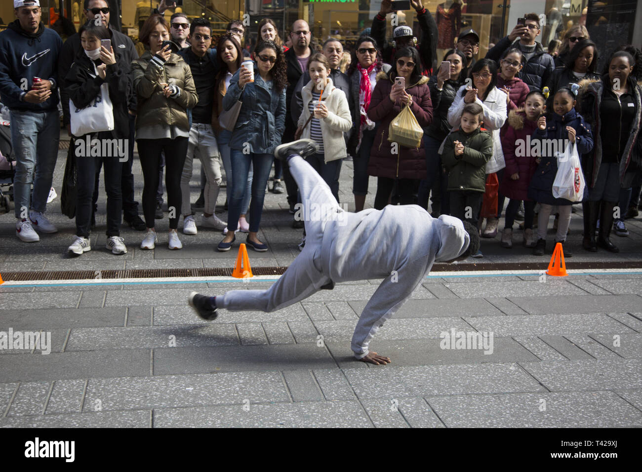 Crowds are entertained in Times Square by a troupe of talented ...