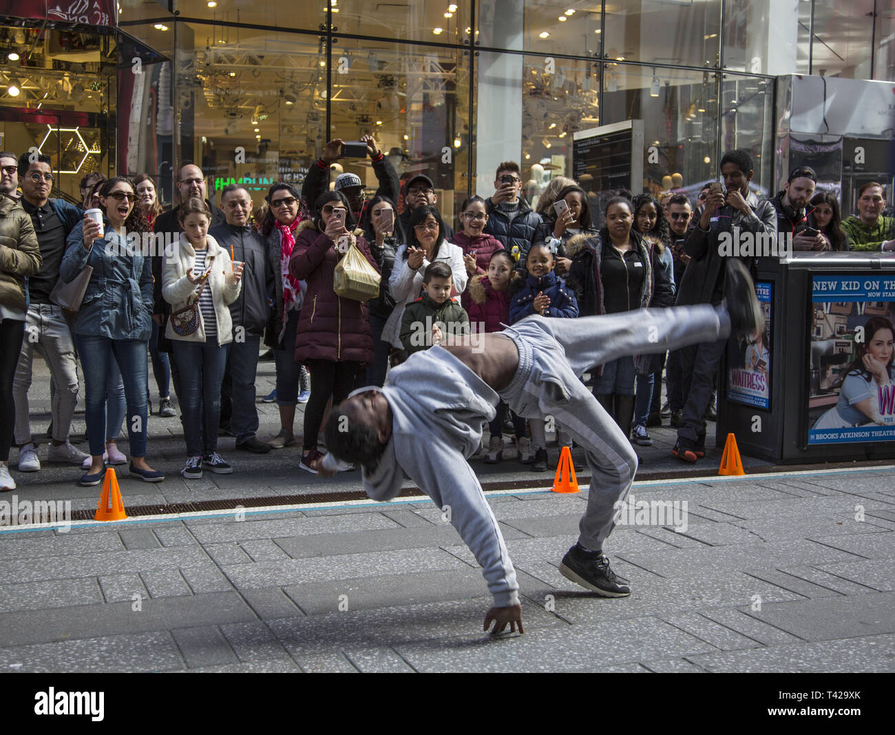 Crowds are entertained in Times Square by a troupe of talented ...