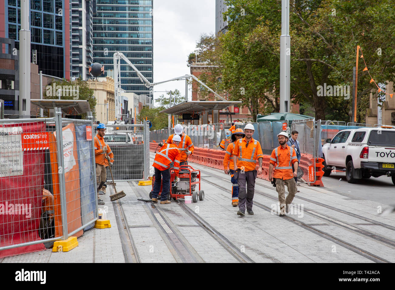 Construction workers in hi viz vests on George street in Sydney city ...