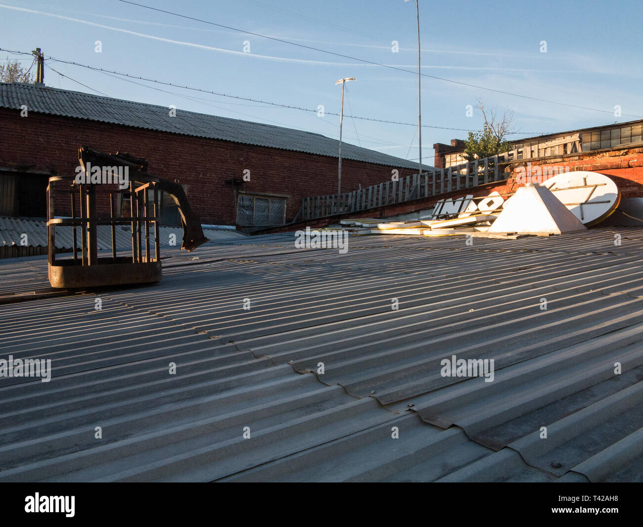 Rooftop of industrial object at the sunset Stock Photo - Alamy