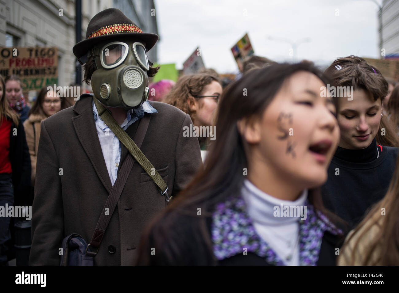 Warsaw, Poland. 12th Apr, 2019. An activist is seen wearing an old gas ...