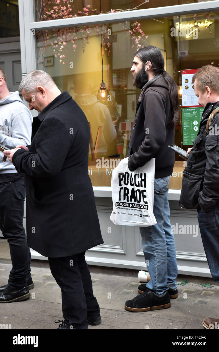 Soho, London, UK. 13th Apr, 2019. Vinyl record fans queue to buy ...