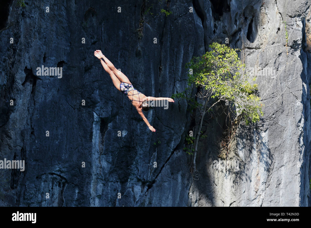 Palawan Province, Philippines. 13th Apr, 2019. A diver jumps off the ...