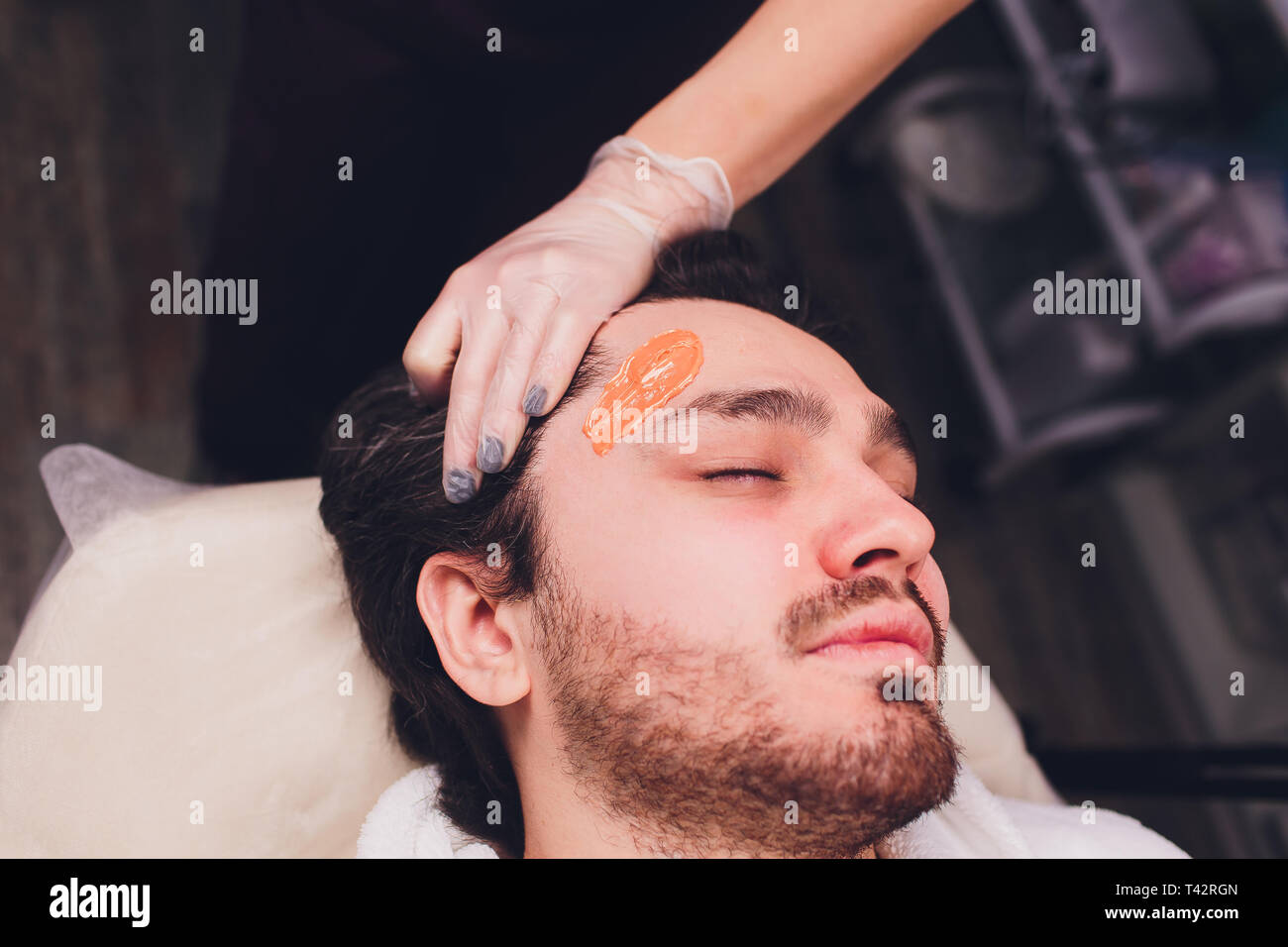 Hair removal. Man's face sugaring epilations beard trimming, yellow ...