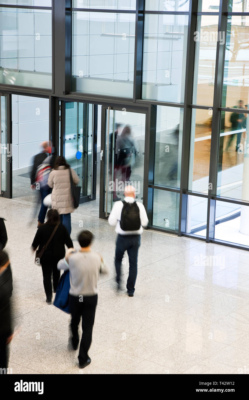 People Leaving an Office Building, Motion Blur Stock Photo - Alamy