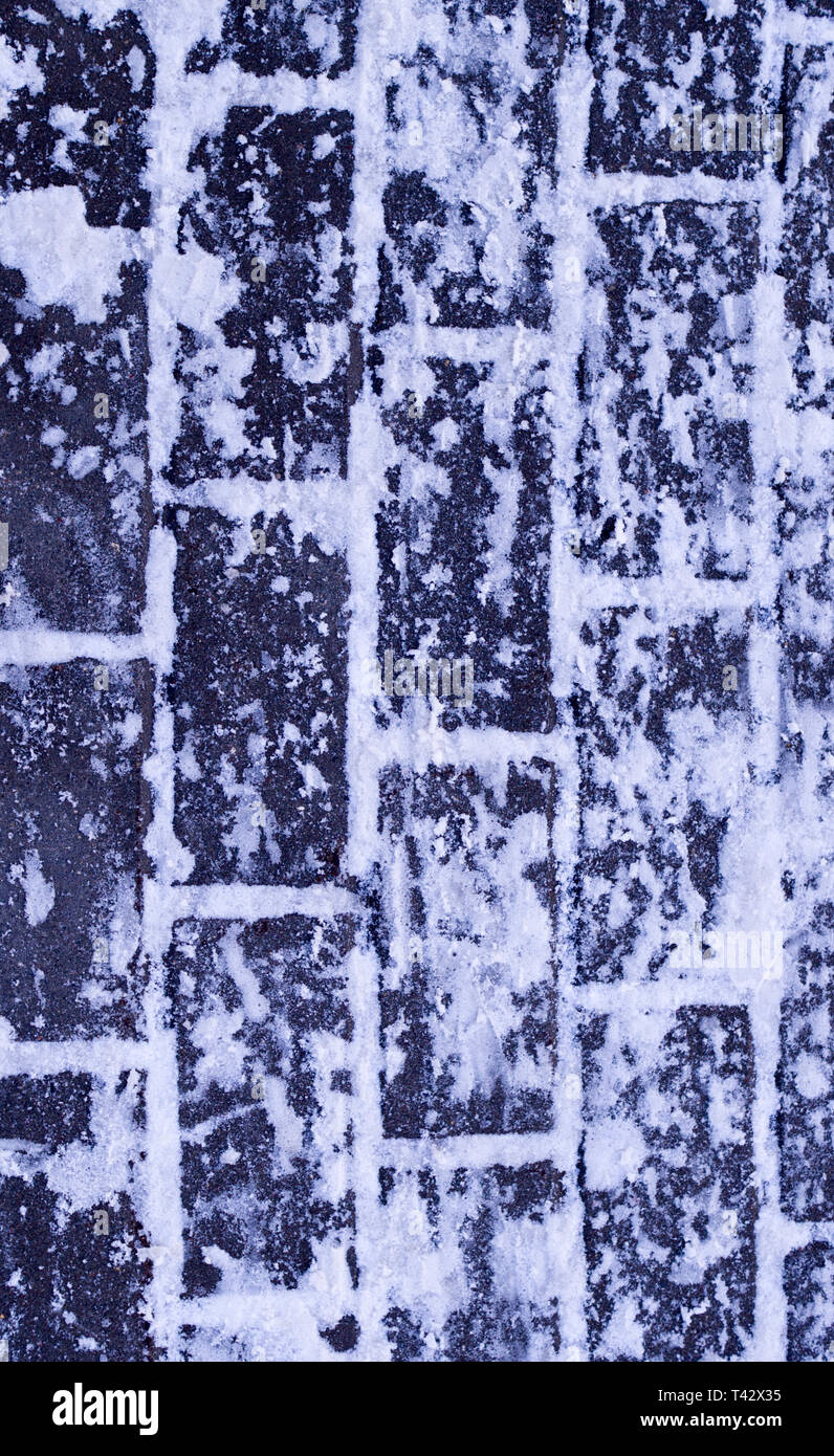 sidewalk cobblestone pavement covered with snow. seasonal, background ...