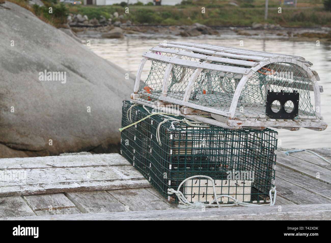 Different kinds of lobster traps on wharf Stock Photo - Alamy