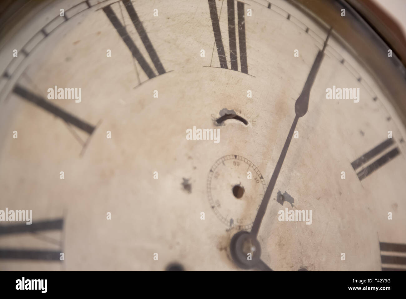 A vintage roman numeral wall clock Stock Photo - Alamy
