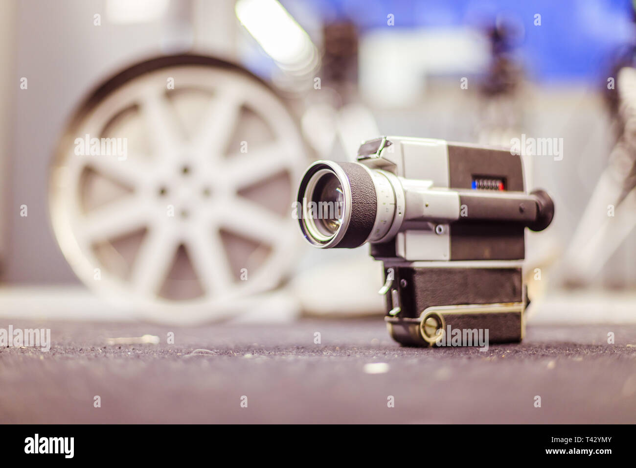 Vintage old movie camera, production studio in the blurry background ...