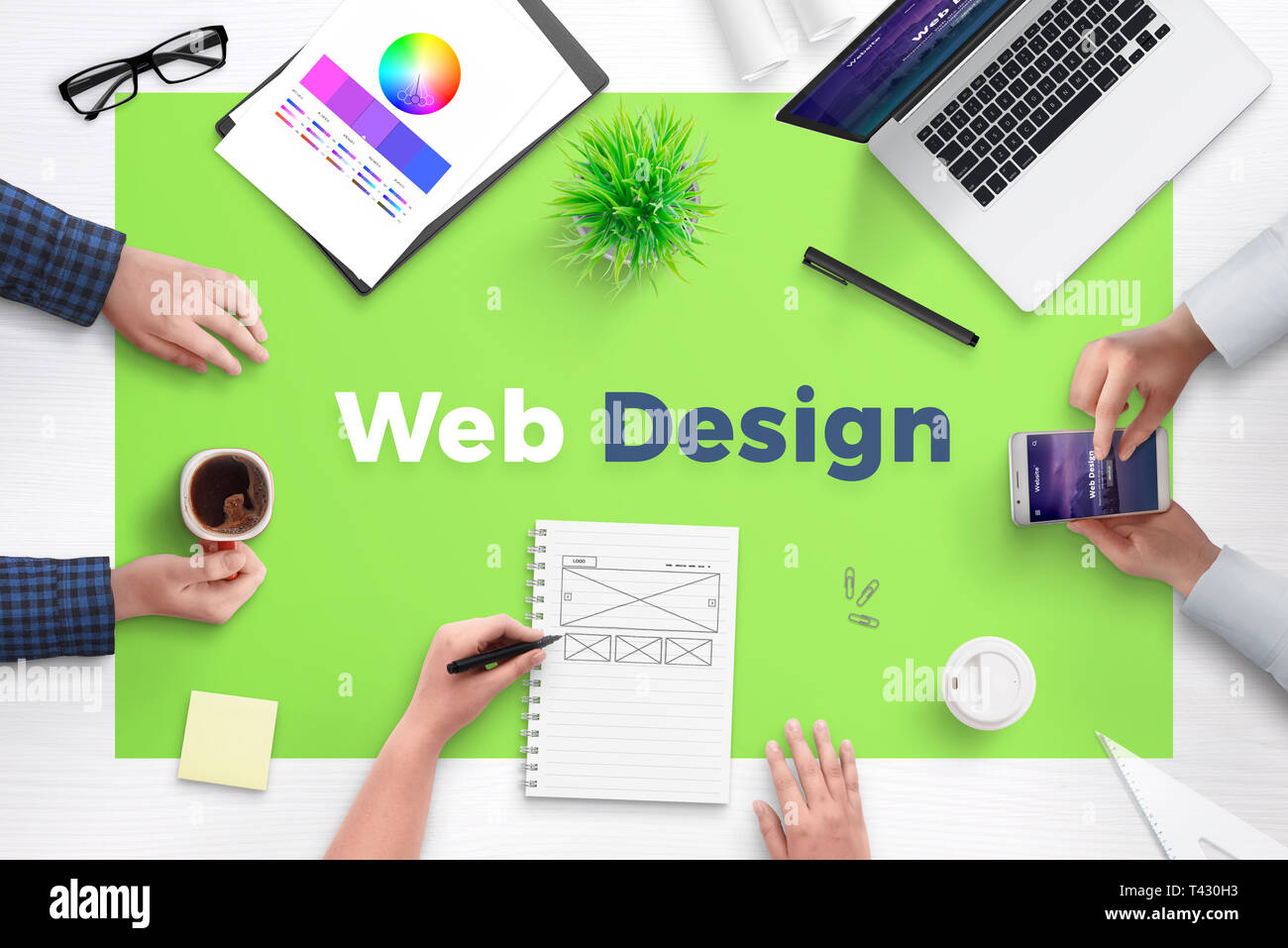 Web design text on office desk. Concept of web development team work ...