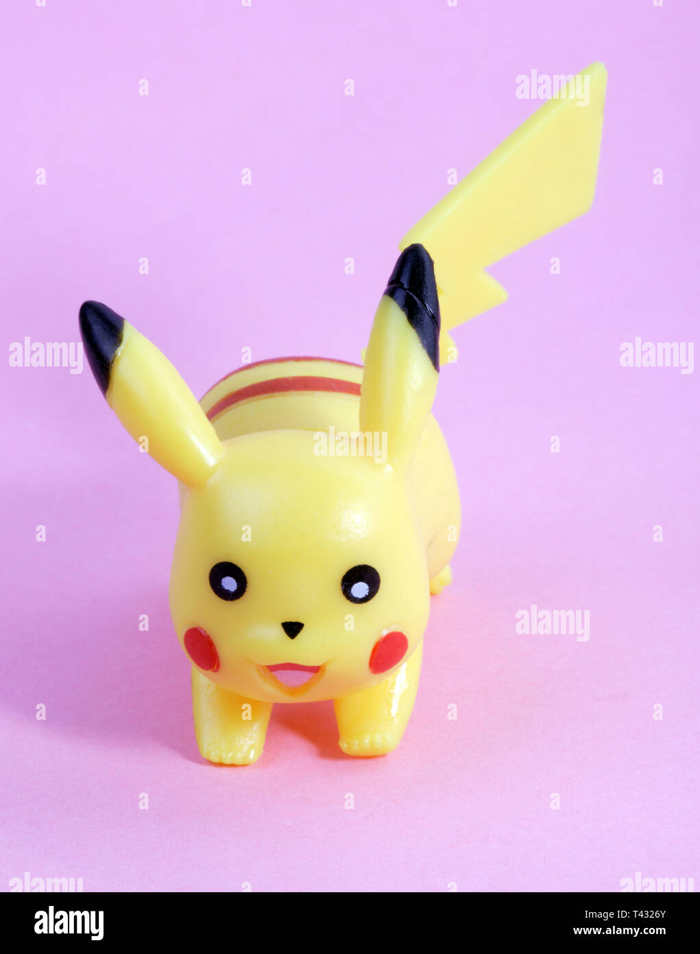 plastic toy on pink background Stock Photo - Alamy