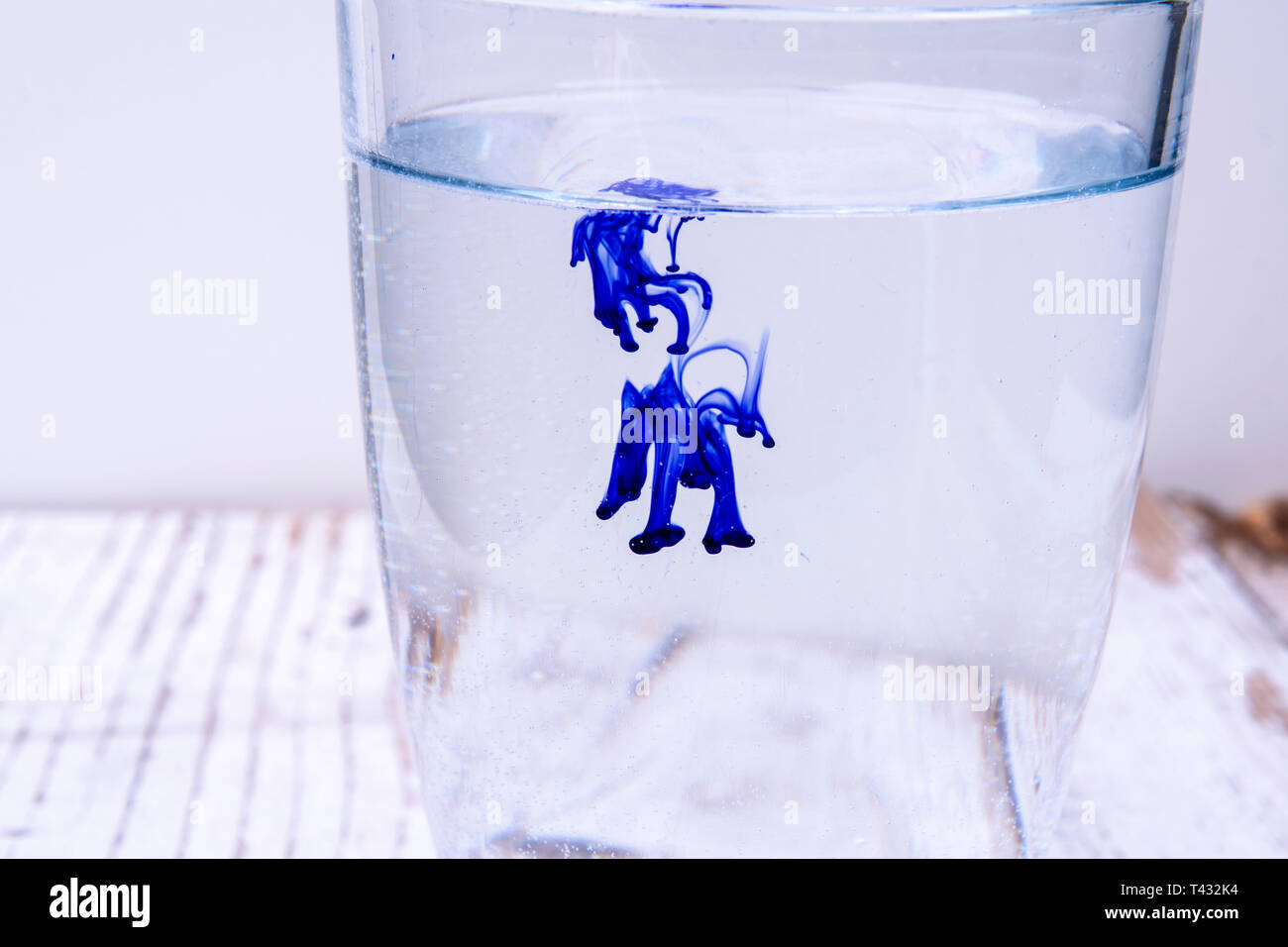 blue ink structure in a water glass Stock Photo - Alamy