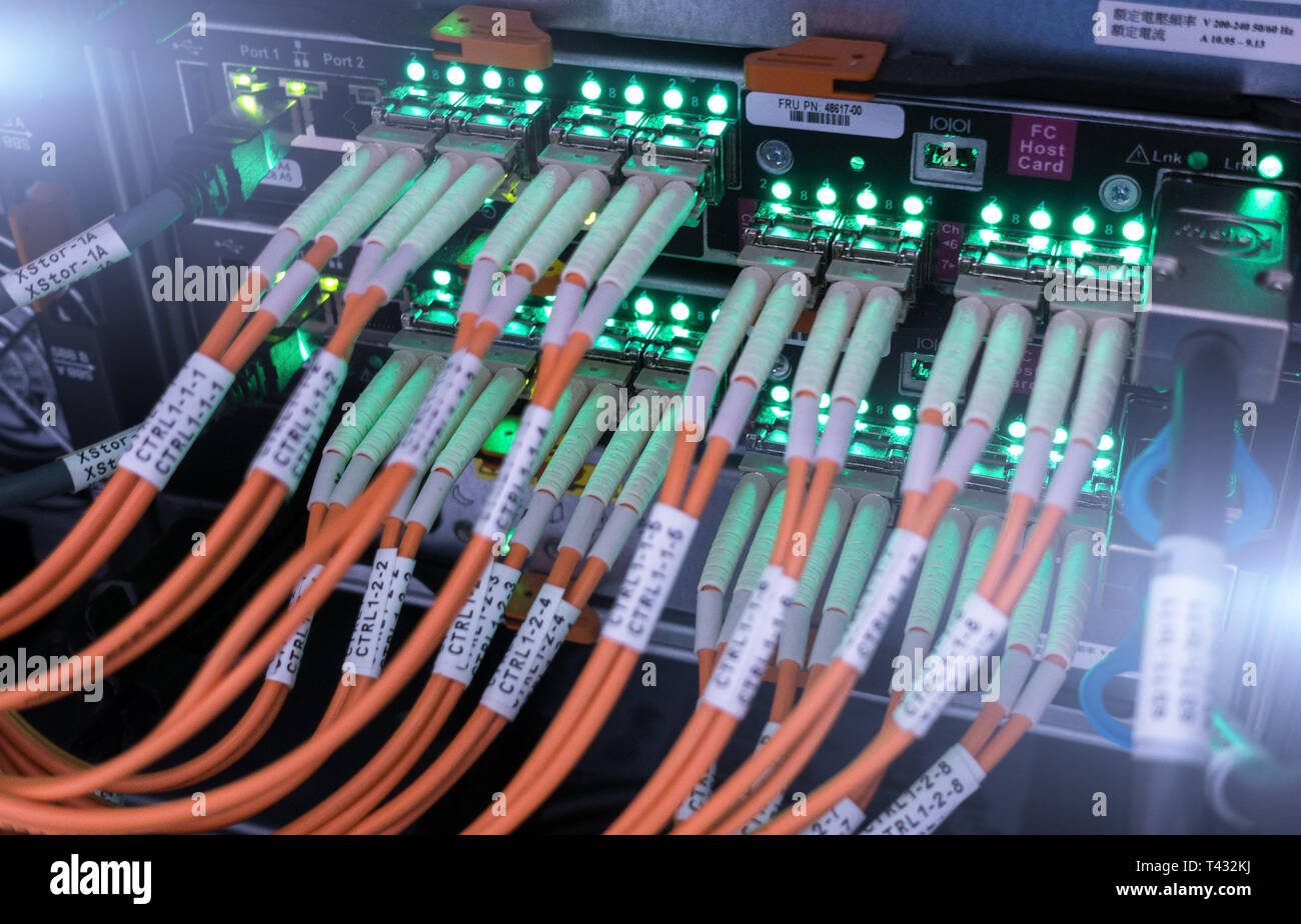 Optical switch and colorfull FC cables connected. Datacenter. Close up ...