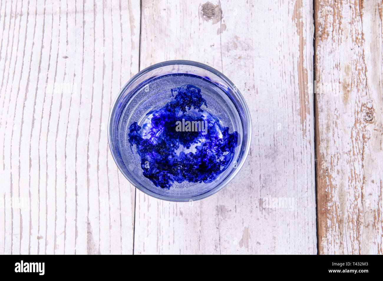 Glass with blue liquid from above Stock Photo - Alamy
