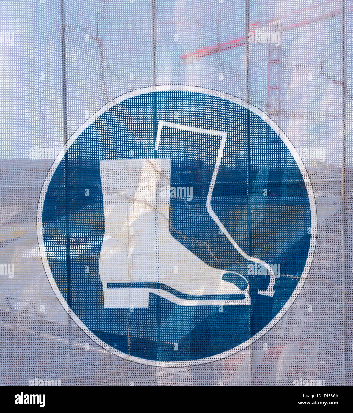 Symbol on a transparent tarpaulin, through which parts of the jobsite ...