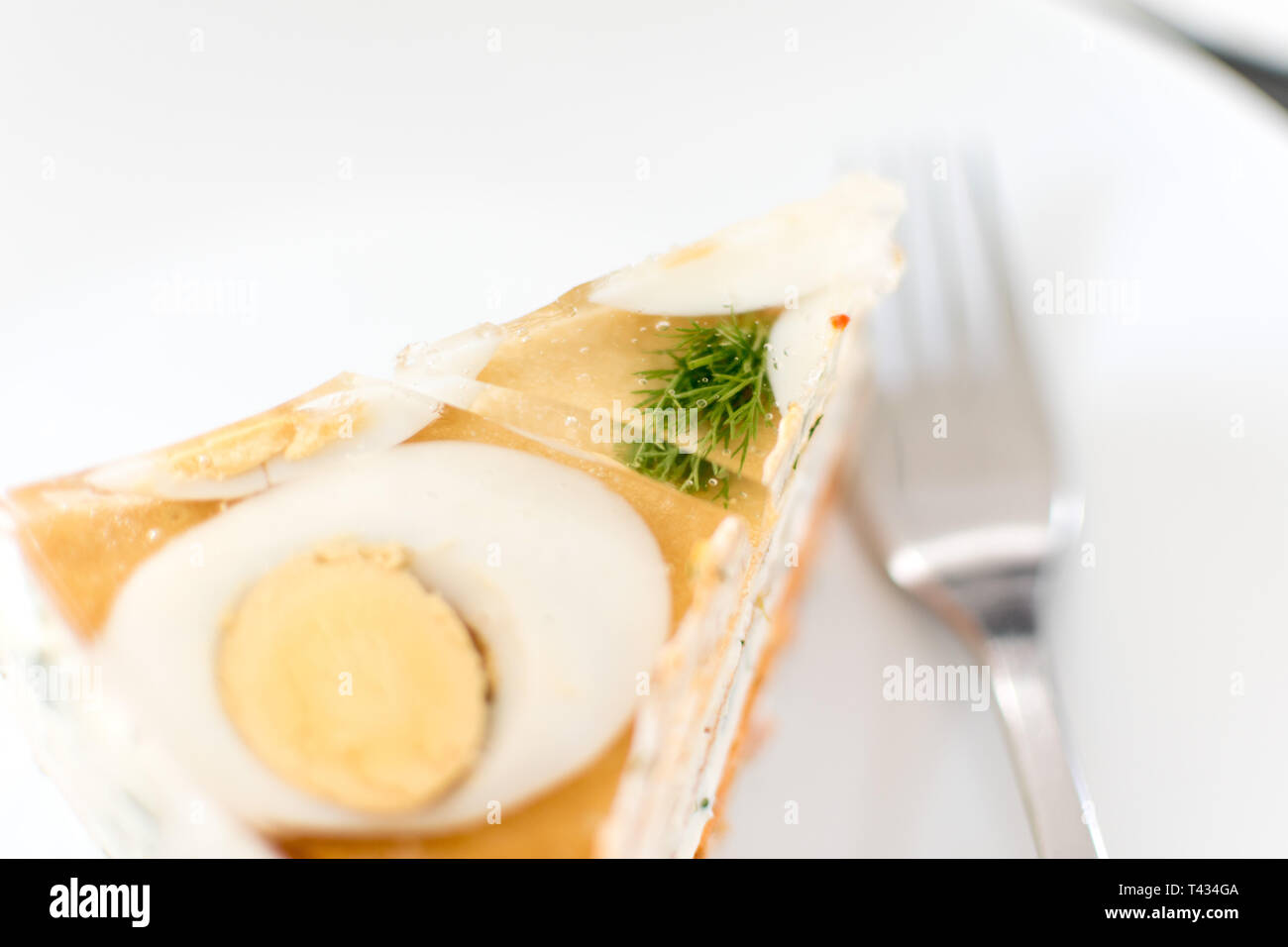 Closeup view of the top surface of a piece of salt cake with pancakes ...