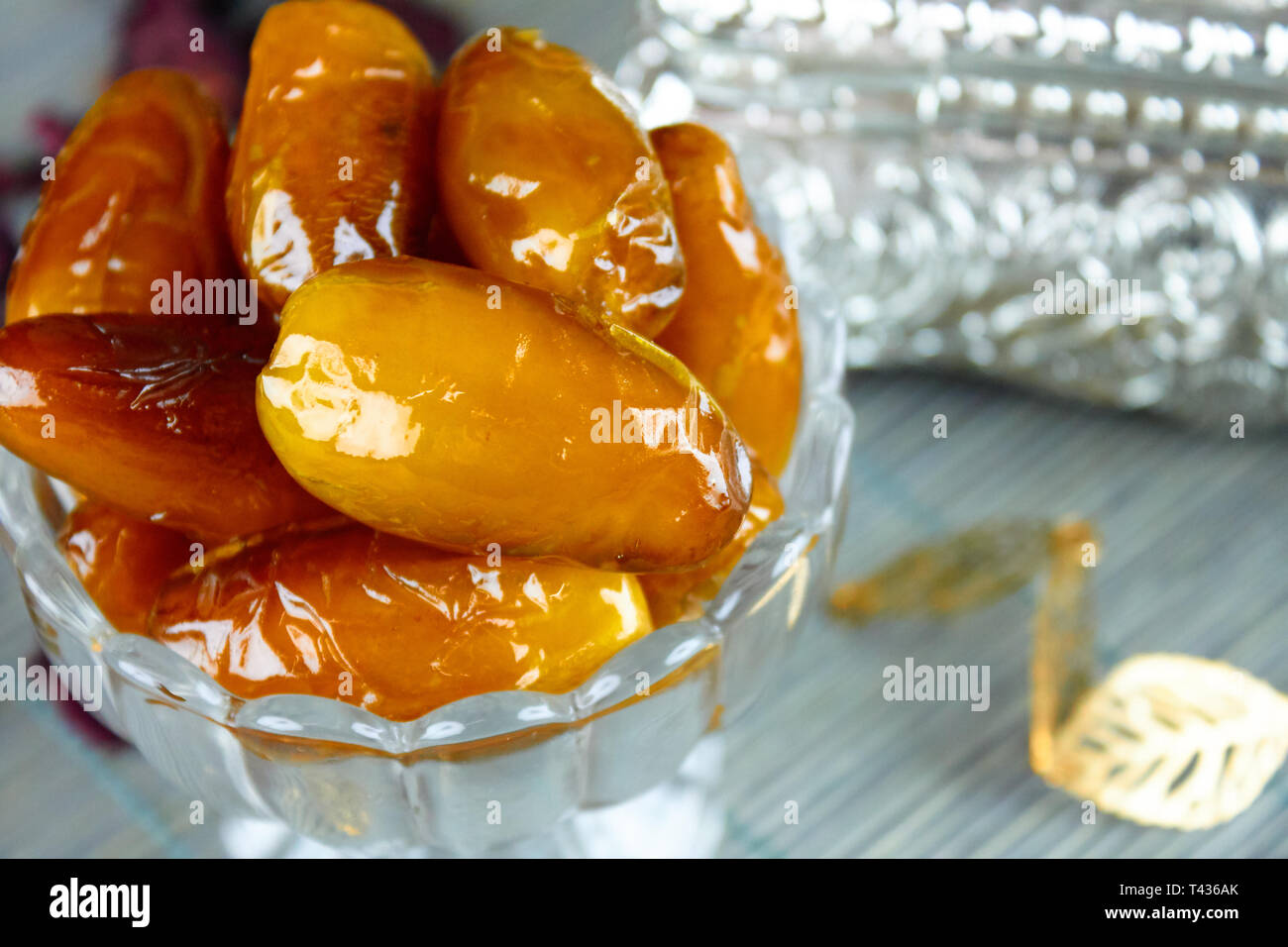 sweet algerian arabic dates fruits on a glass plate Stock Photo - Alamy